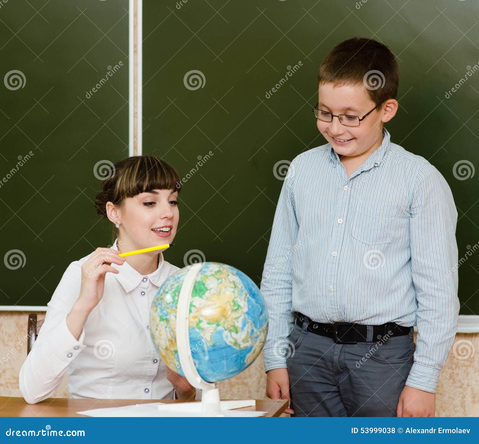 The Teacher Teaches Lessons With A Student Sitting At The Table Stock ...