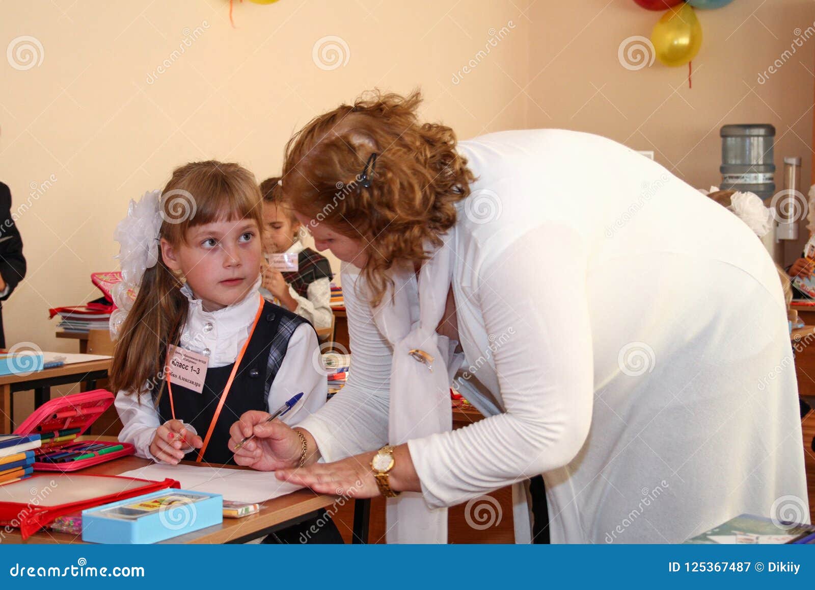 The Teacher Teaches the First Class Student To Write Editorial ...