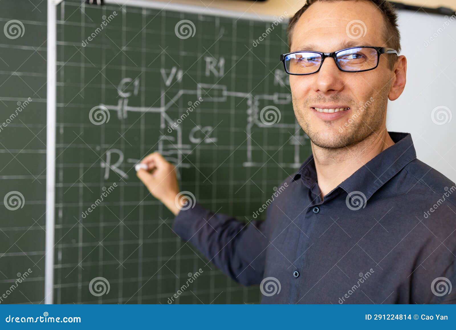Portrait of a Confident Caucasian Male Teacher in Class Stock Photo ...