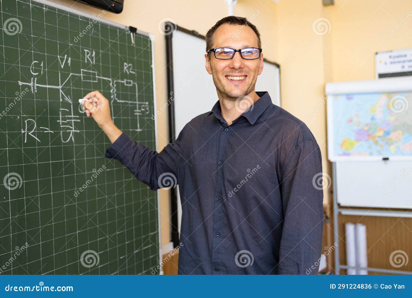 Portrait of a Confident Caucasian Male Teacher in Class Stock Photo ...