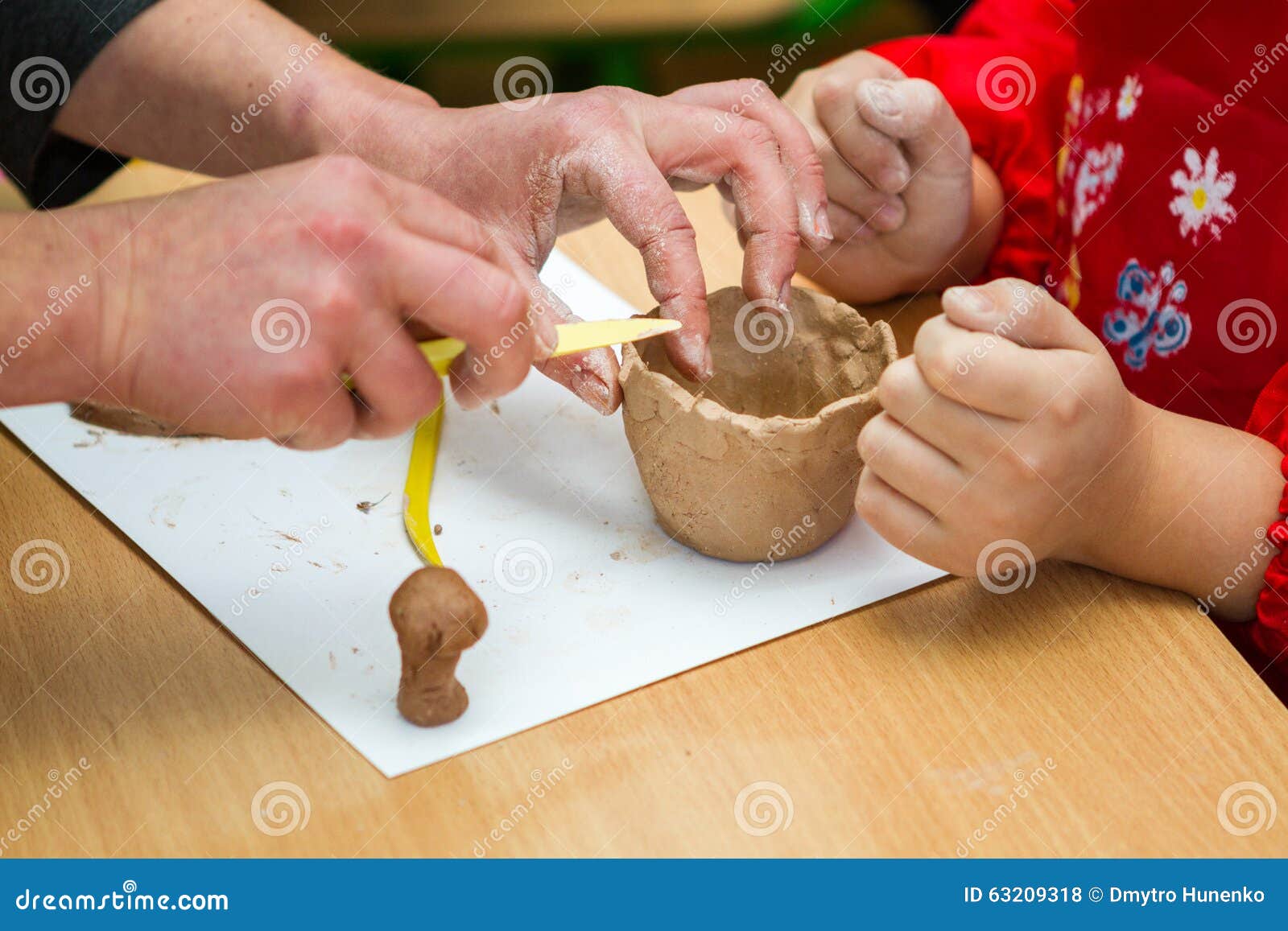 The Teacher Teaches the Student To Sculpt with Clay. Stock Photo ...