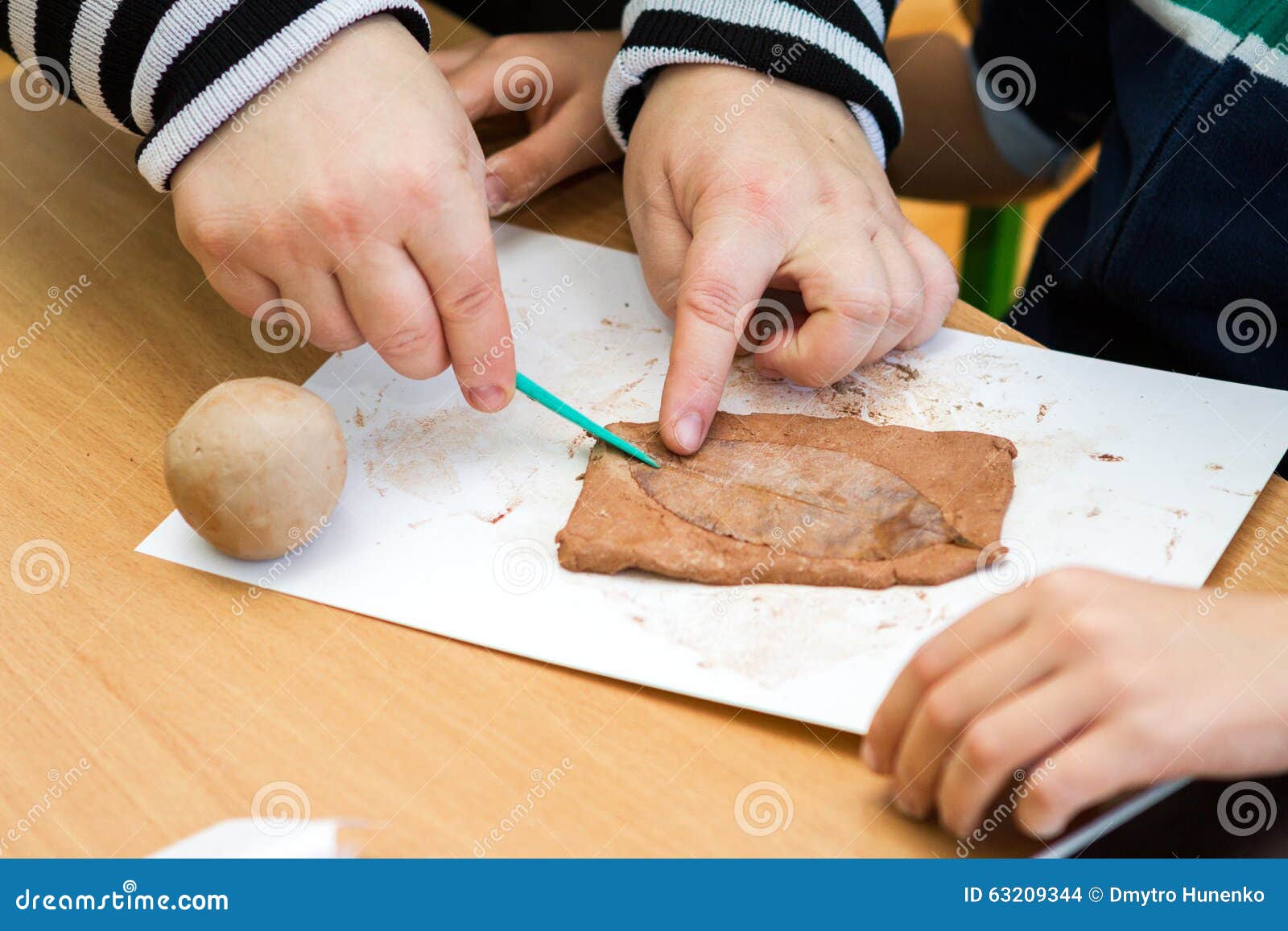The Teacher Teaches the Student To Sculpt with Clay. Stock Photo ...