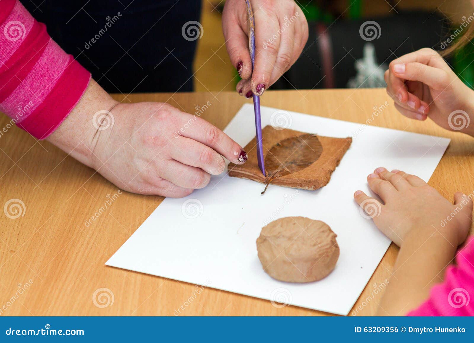 The Teacher Teaches the Student To Sculpt with Clay. Stock Photo ...