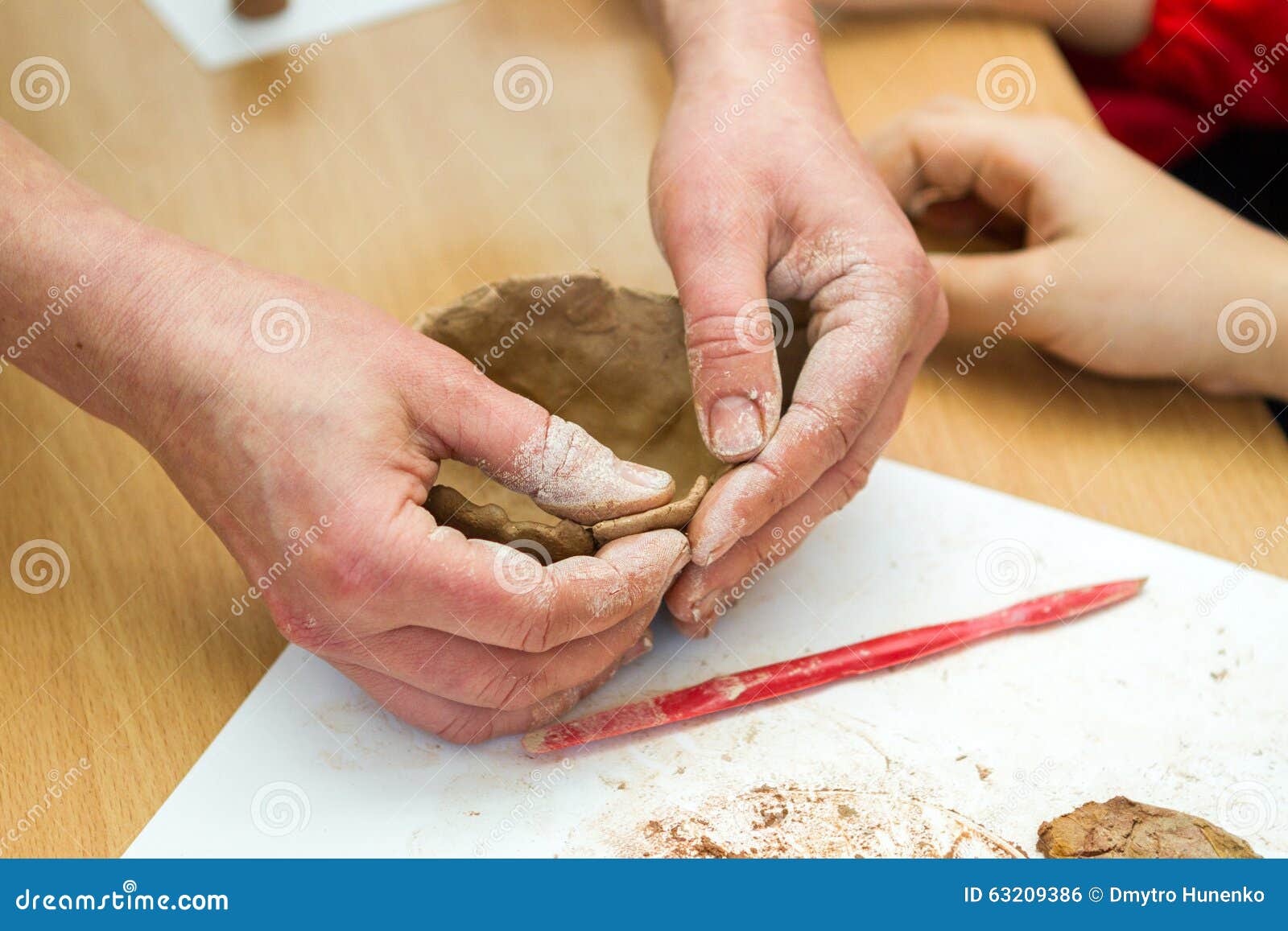 The Teacher Teaches the Student To Sculpt with Clay. Stock Photo ...