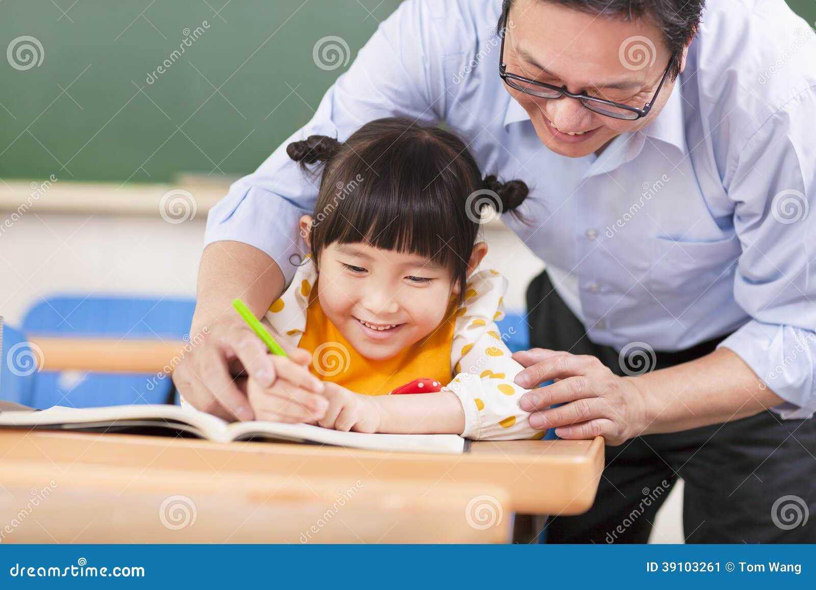 Teacher Teaches a Student To Using a Pencil Stock Image - Image of male ...