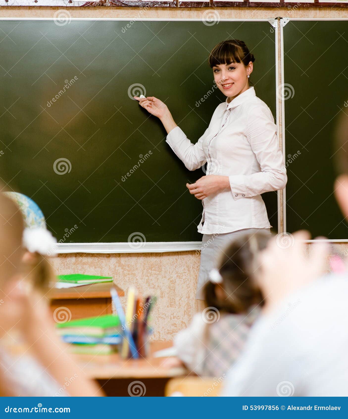 The Teacher Teaches Lessons With A Student Sitting At The Table Stock ...