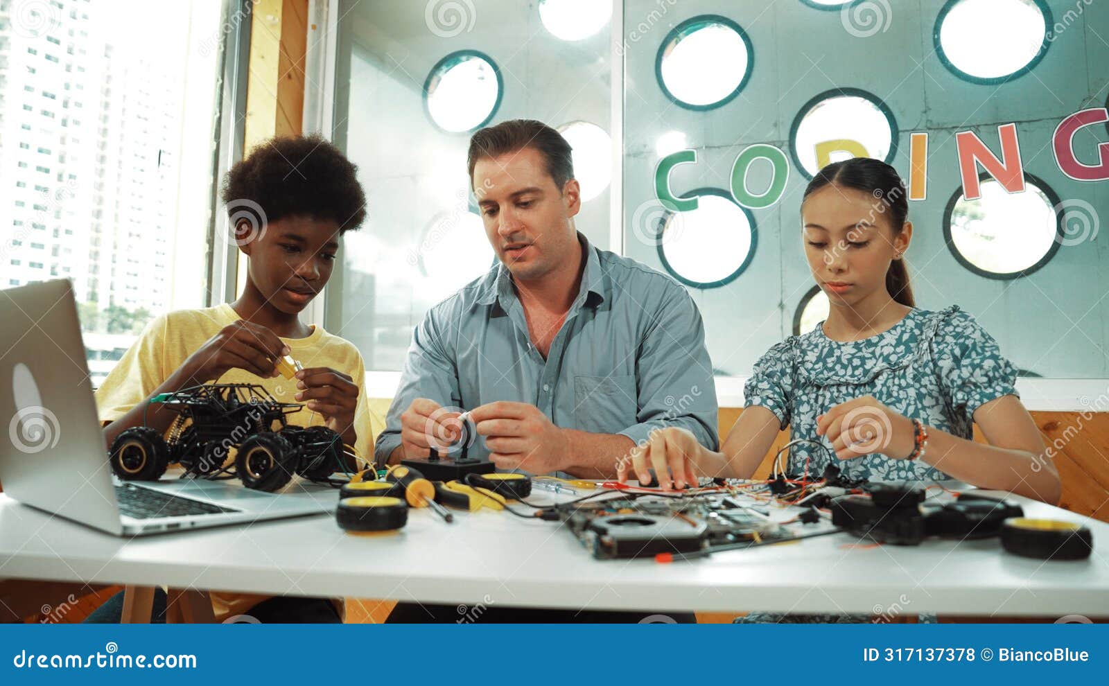 Teacher Teaching Diverse Students Fixing Car Model by Using Wire ...