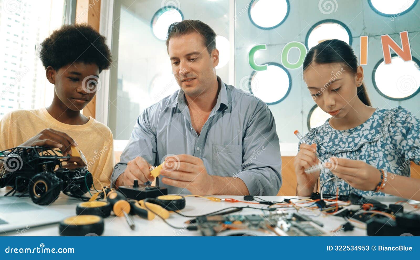 Teacher Teaching Diverse Students Fixing Car Model by Using Wire ...