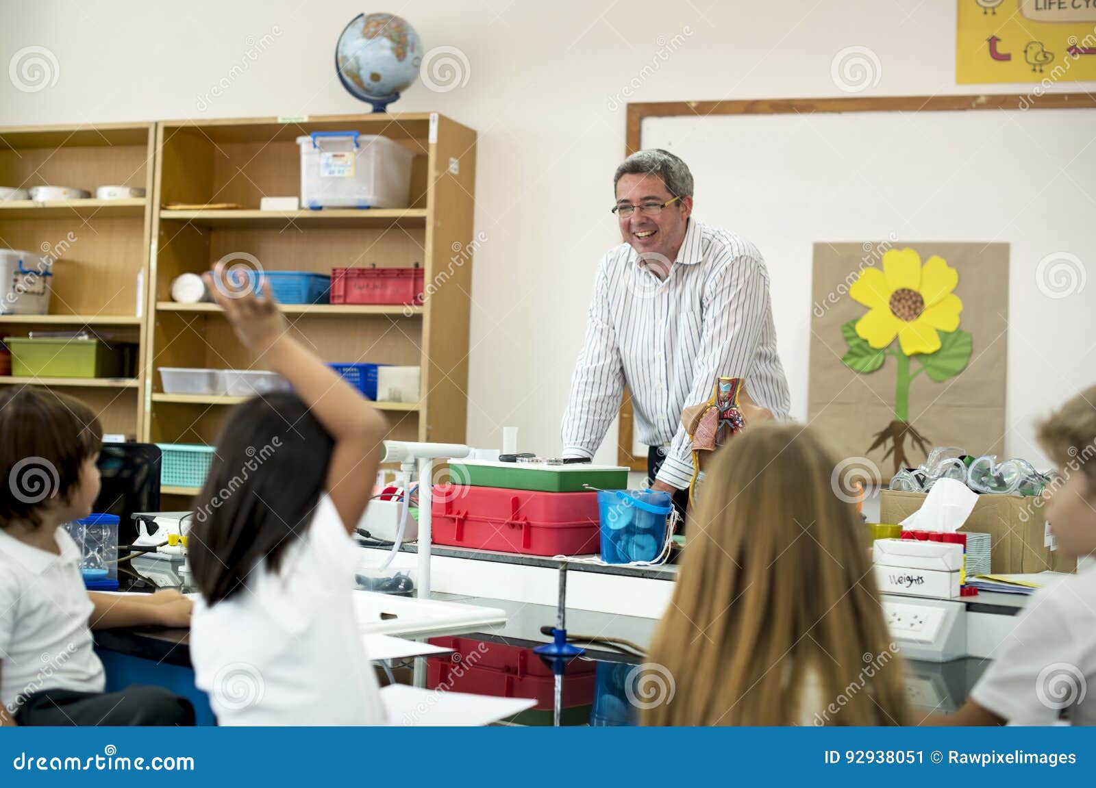 Teacher Teaching Flower Structure To Diverse Kindergarten Stock Image ...