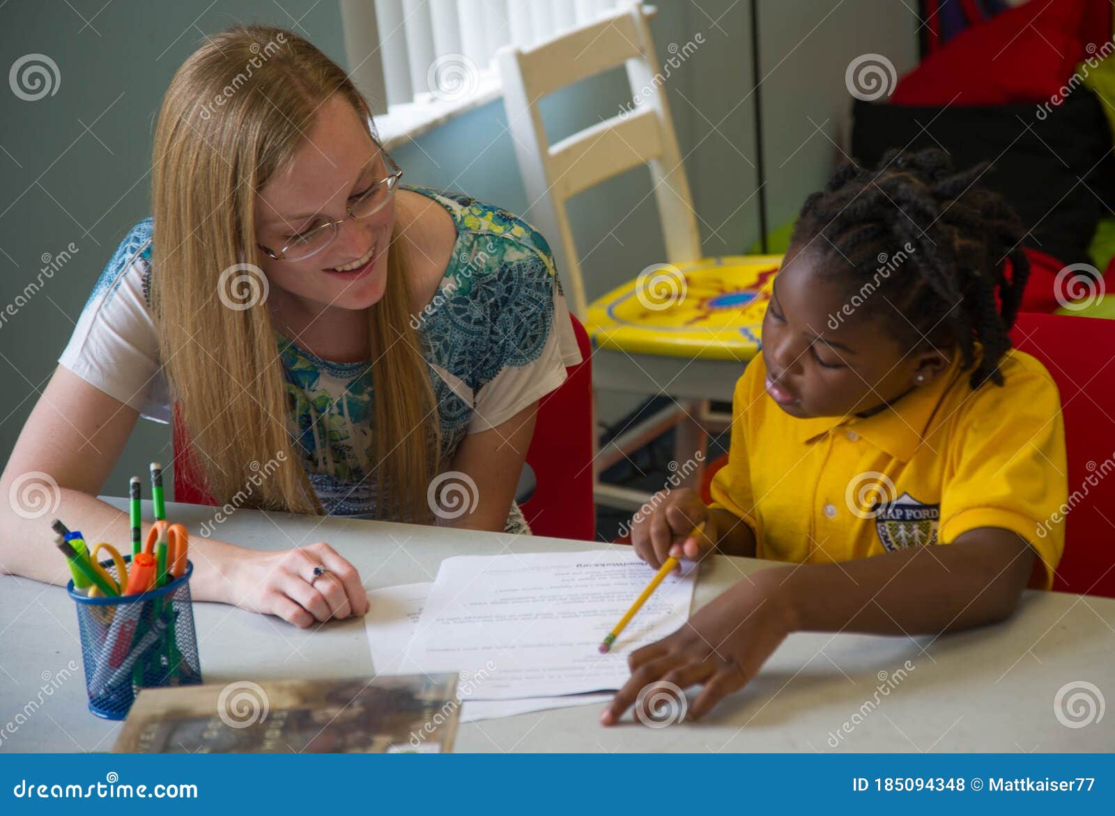 Teacher Teaching Her Student in a Classroom.Located in Orlando Florida ...