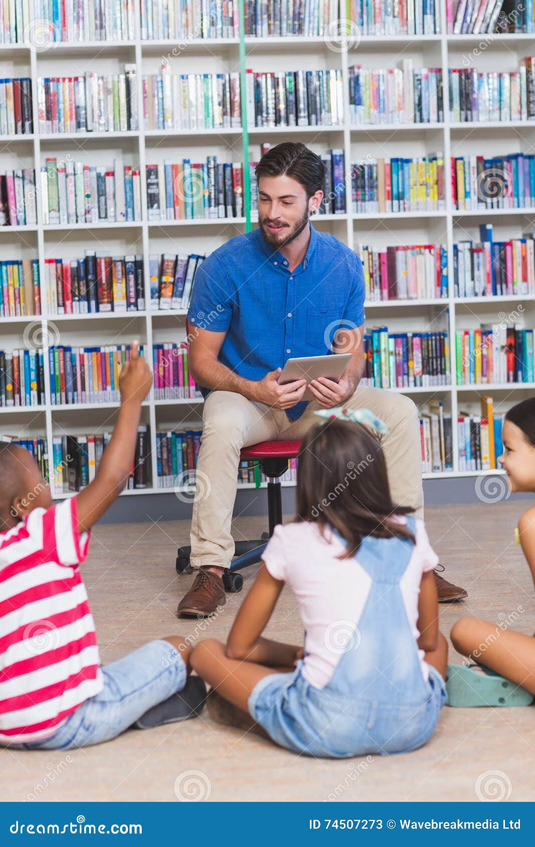 Teacher Teaching Kids on Digital Tablet in Library Stock Image - Image ...