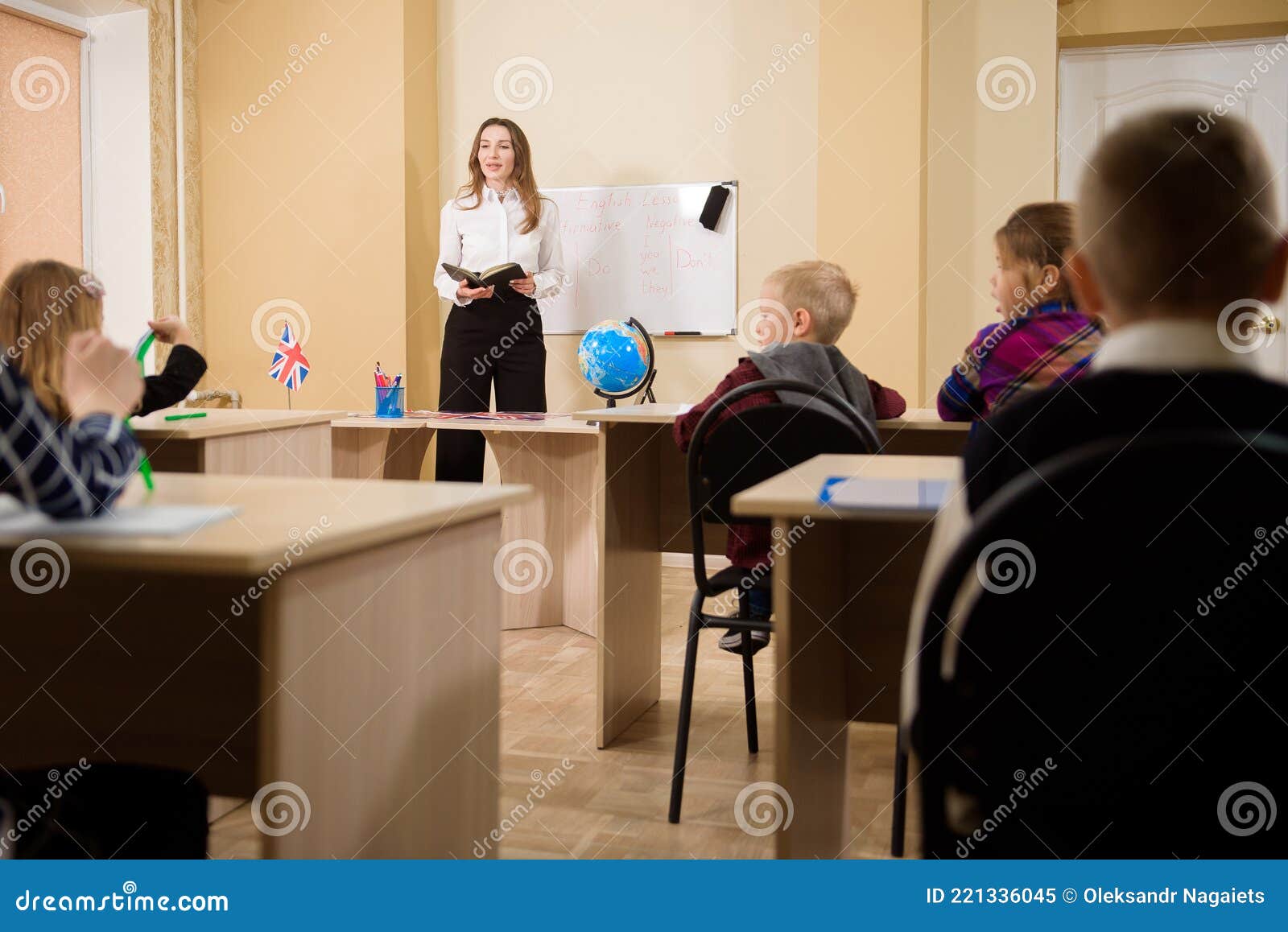 Teacher Teaching Lesson To Elementary School Pupils. Stock Image ...