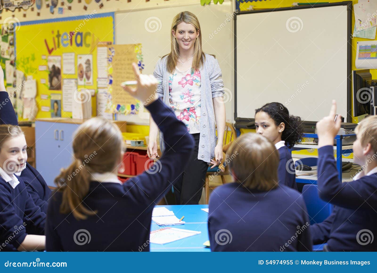 Teacher Teaching Lesson To Elementary School Pupils Stock Image - Image ...