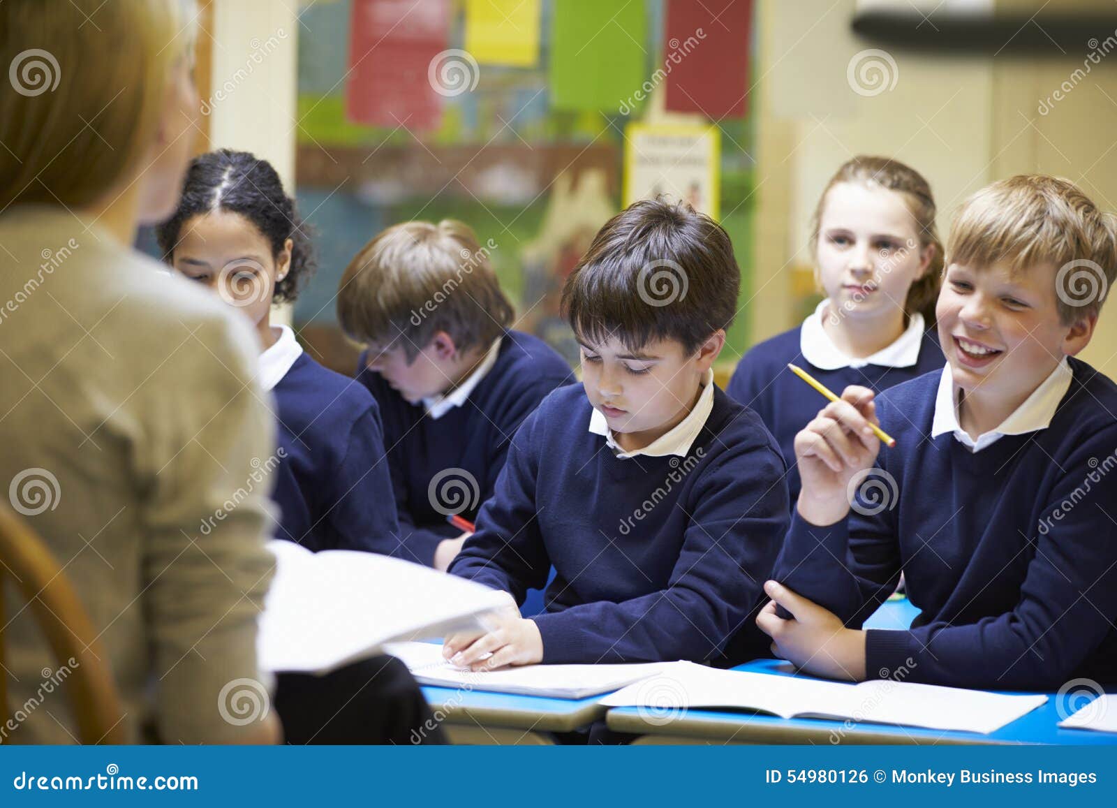 Teacher Teaching Lesson To Elementary School Pupils Stock Photo - Image ...