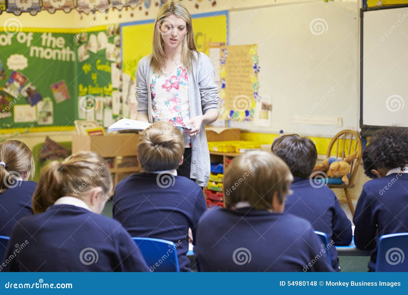 Teacher Teaching Lesson To Elementary School Pupils Stock Photo - Image ...