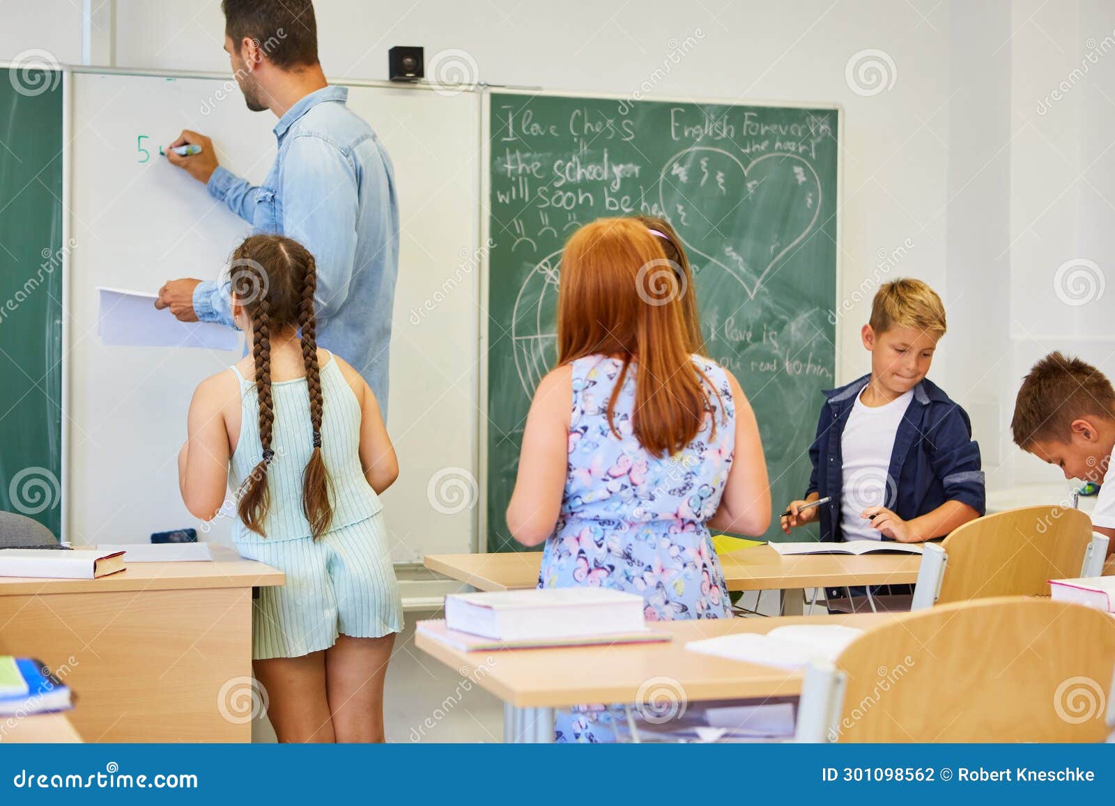 Teacher Teaching Mathematics To Students in Classroom Stock Photo ...