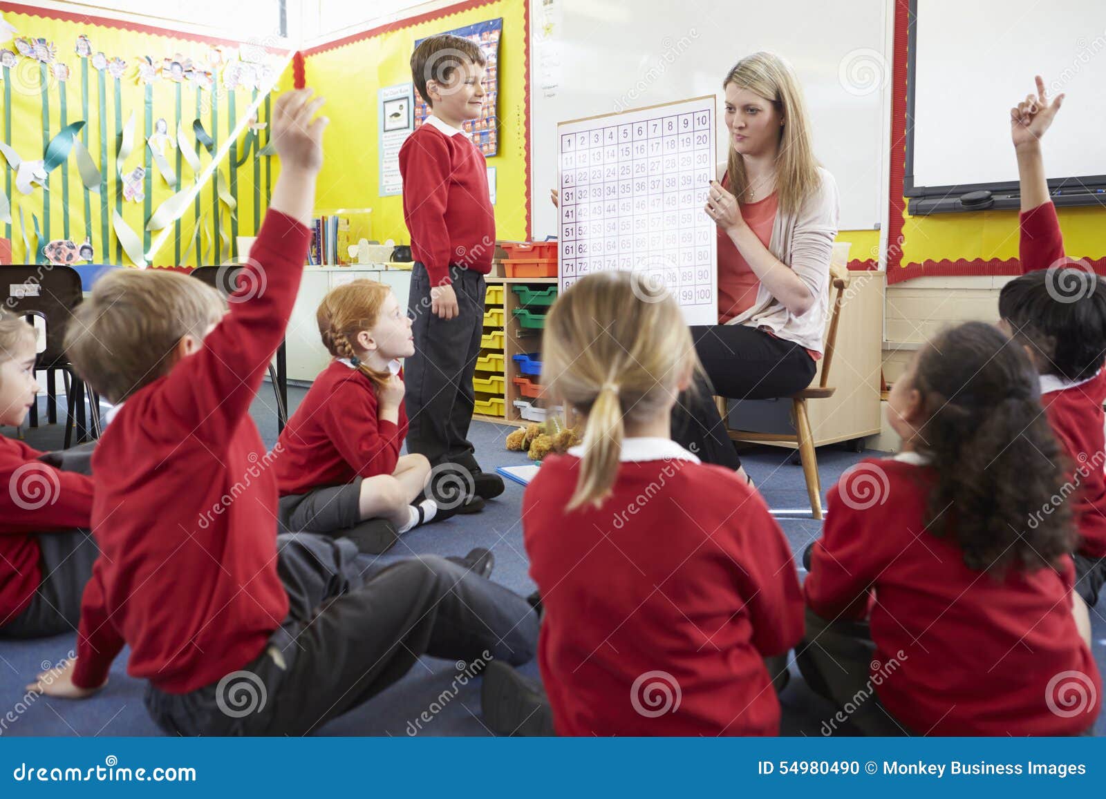 Teacher Teaching Maths To Elementary School Pupils Stock Photo - Image ...