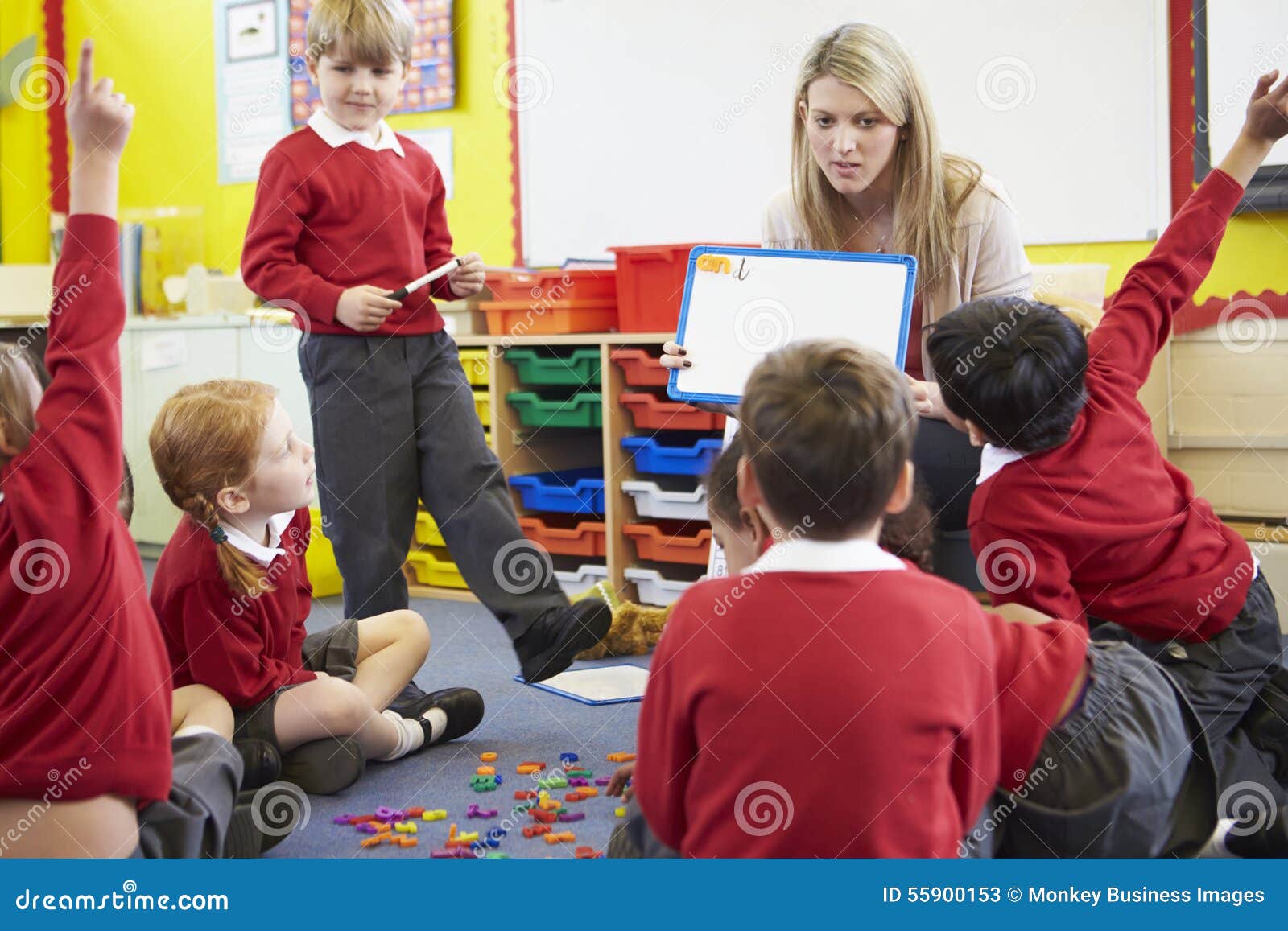 Teacher Teaching Spelling To Elementary School Pupils Stock Image ...