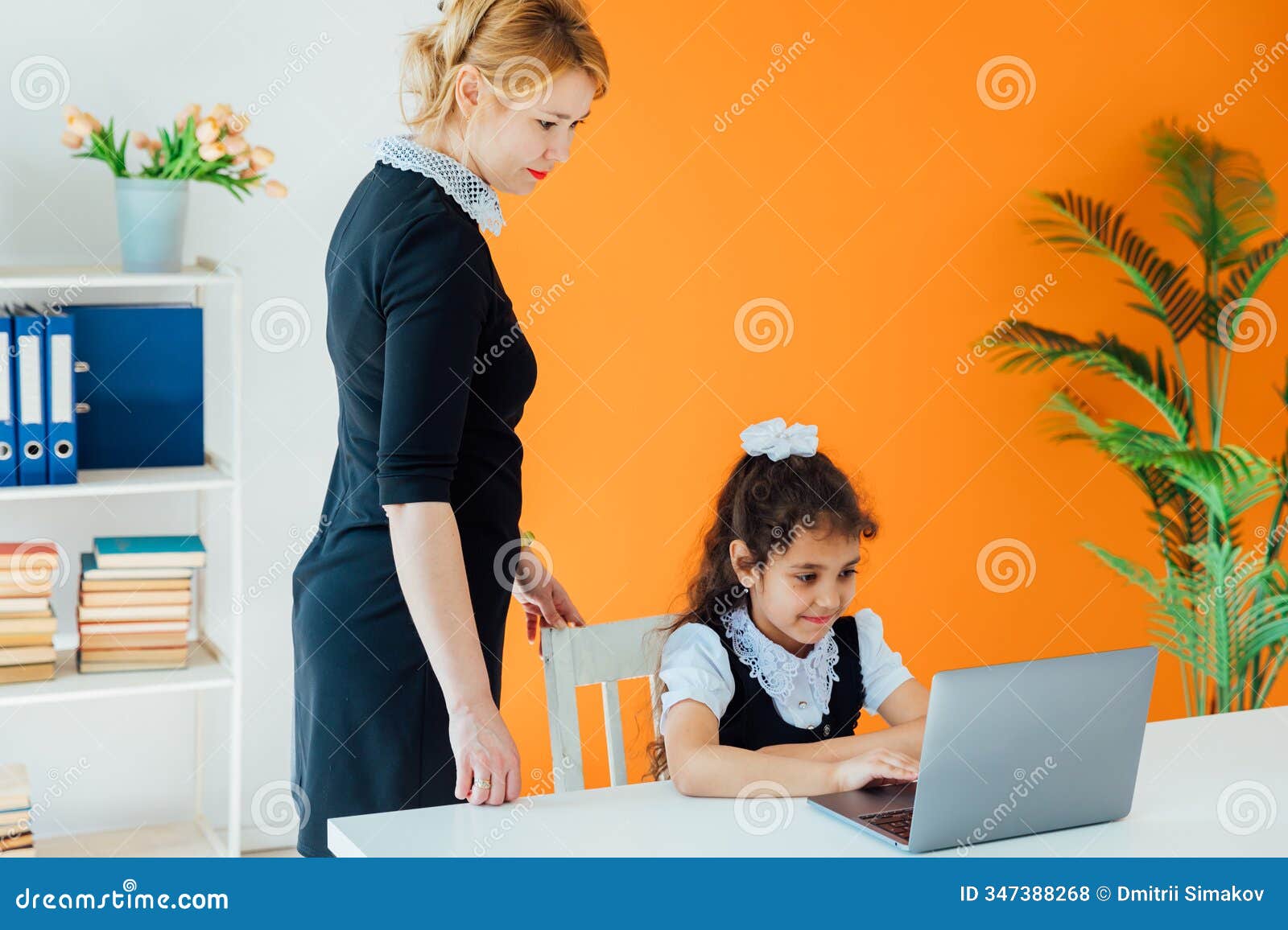 Teacher Teaching Student with Laptop in Classroom Stock Photo - Image ...