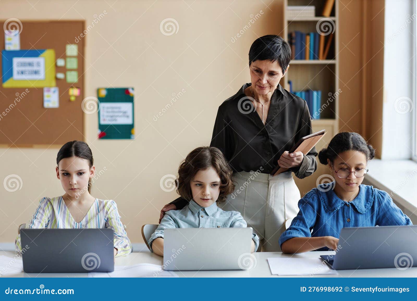 Teacher Teaching Students at Information Technology Lesson Stock Photo ...