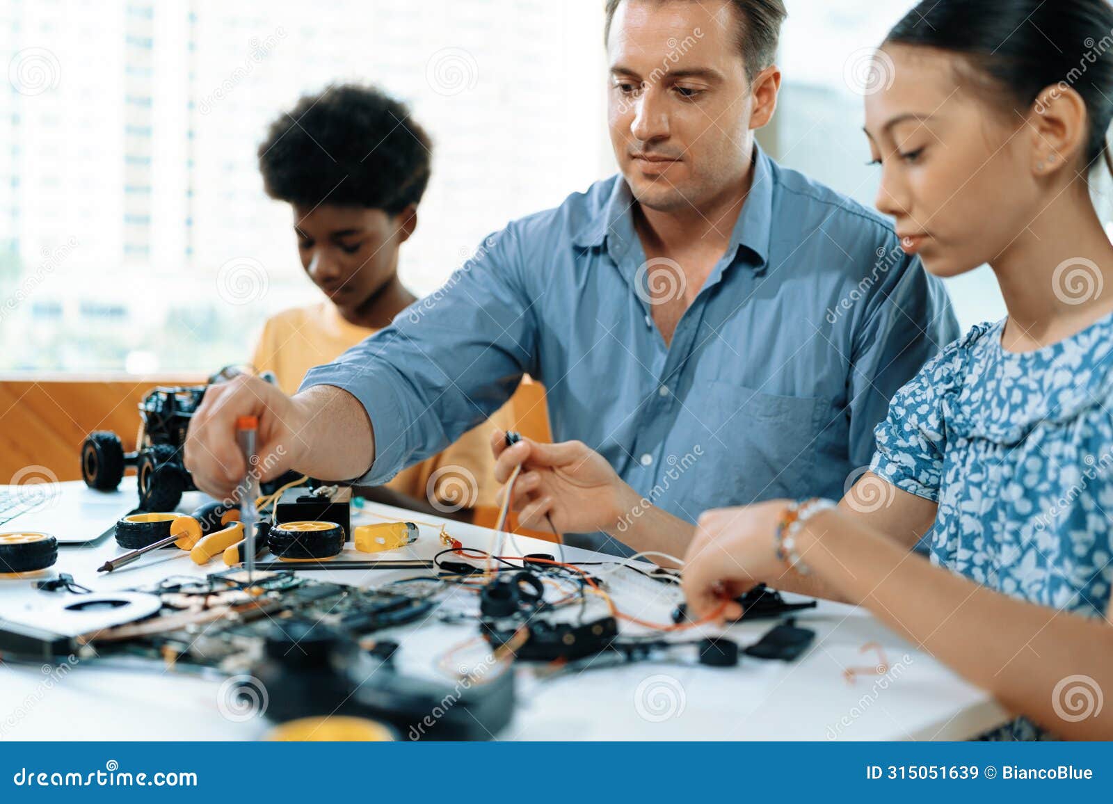 Teacher Teaching Students To Coding Robotics Car in STEM Class ...