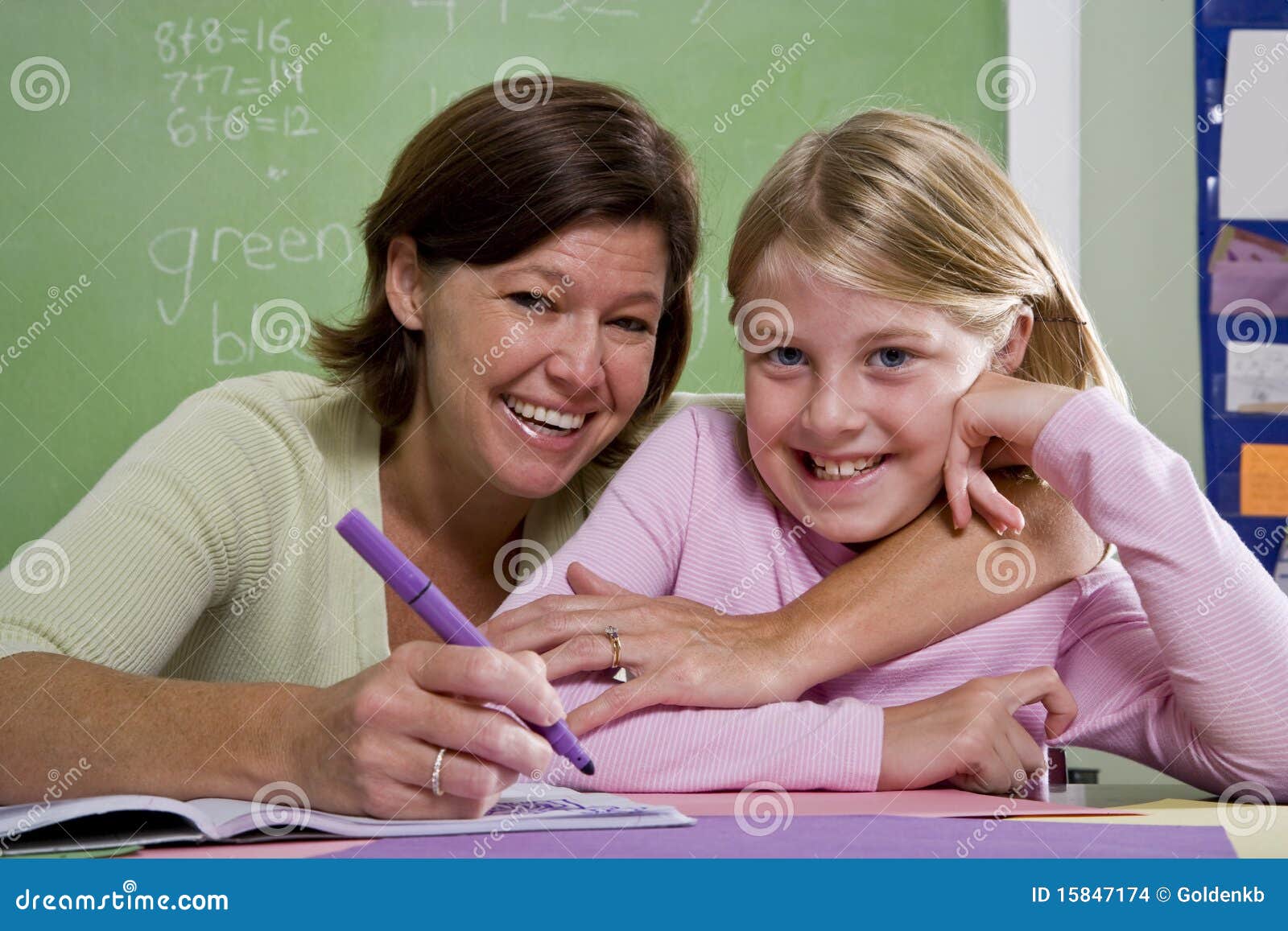 Teacher Teaching Young Student in Classroom Stock Photo - Image of ...