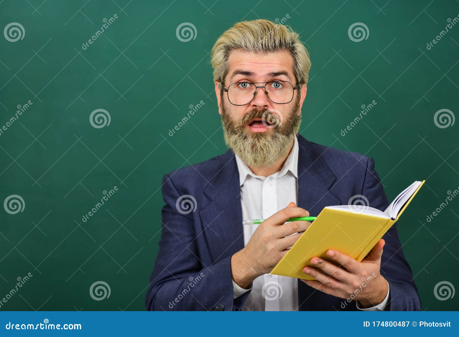 Teacher with Textbook. Experienced Teacher. Selecting Appropriate ...