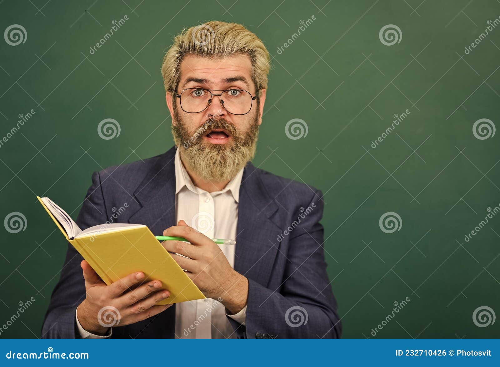 Teacher with Textbook. Experienced Teacher. Selecting Appropriate ...