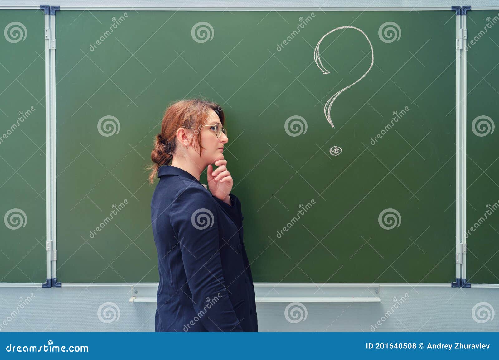 The Teacher is Thoughtfully Standing in Front of a Question Mark ...