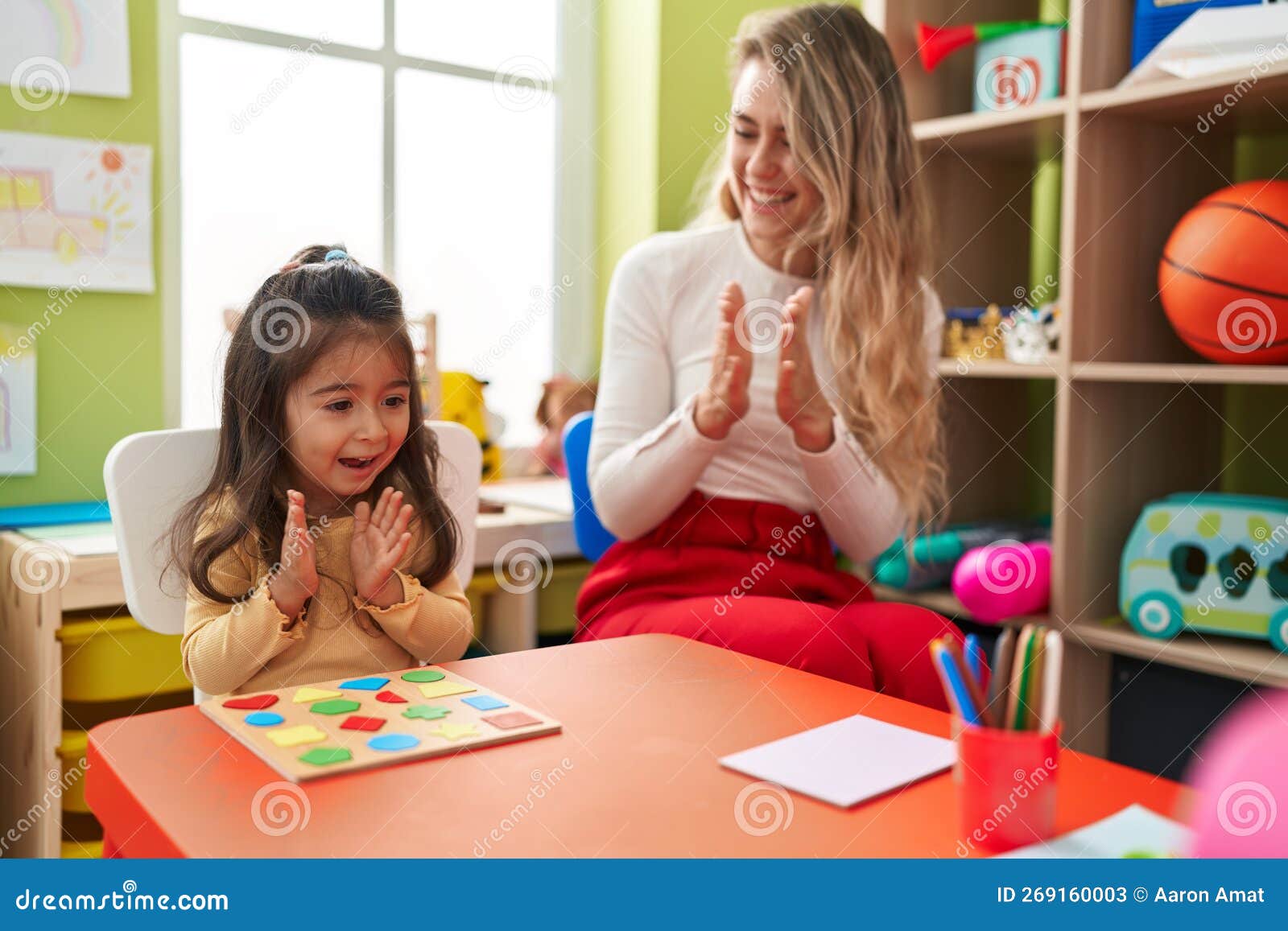Teacher and Toddler Playing with Maths Puzzle Game Applauding at ...