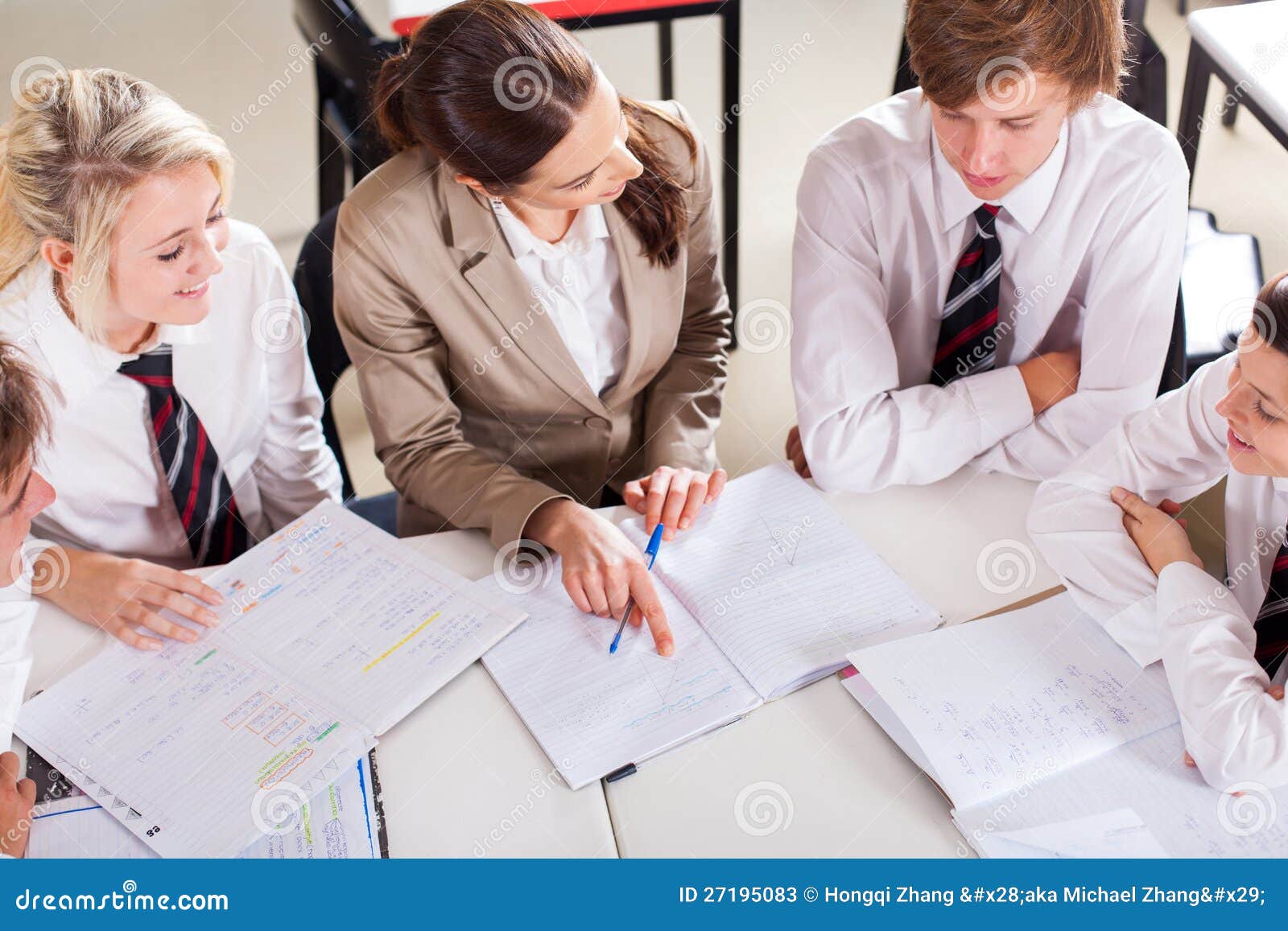 Teacher tutoring students stock image. Image of pretty - 27195083
