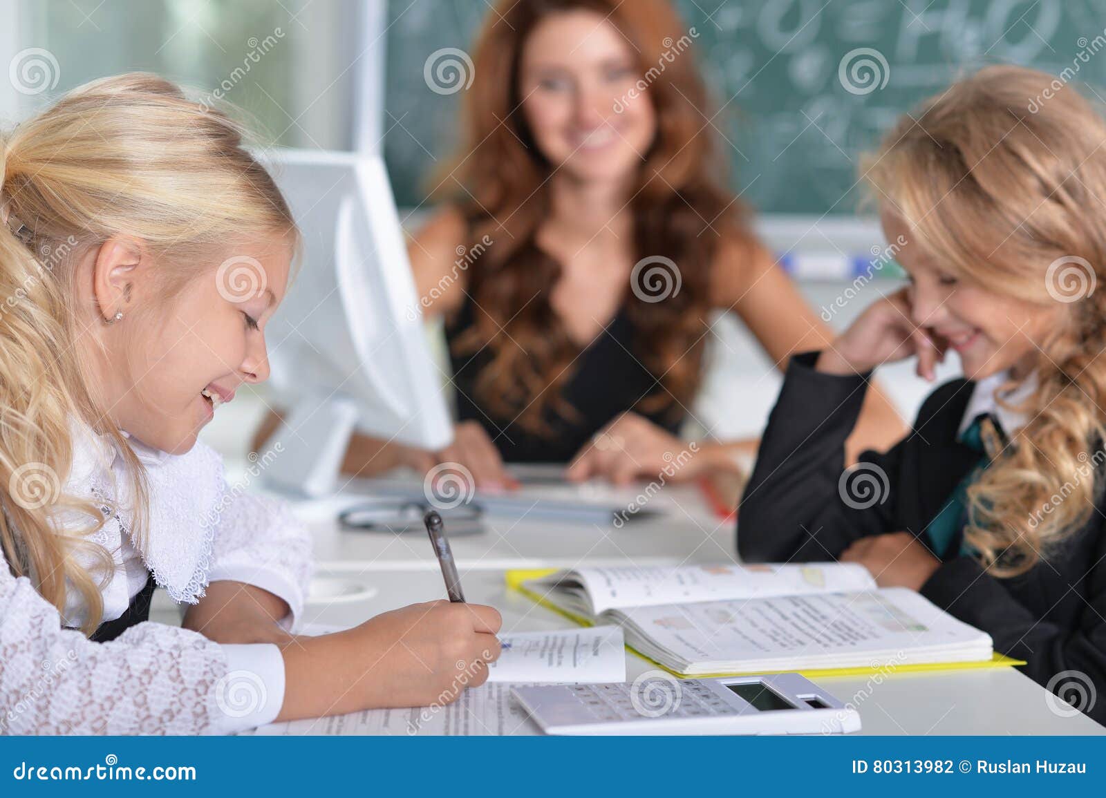 Teacher with two girls stock photo. Image of friendly - 80313982
