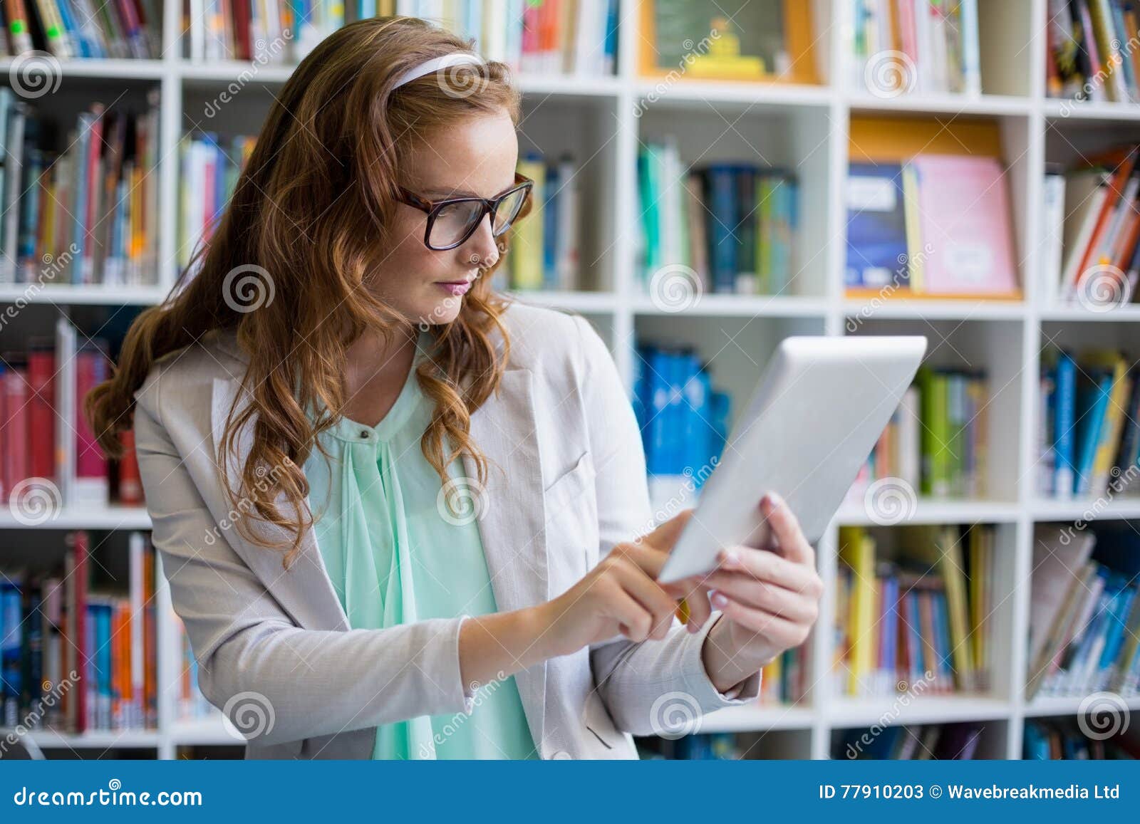 Teacher Using Digital Tablet in Library Stock Image - Image of person ...