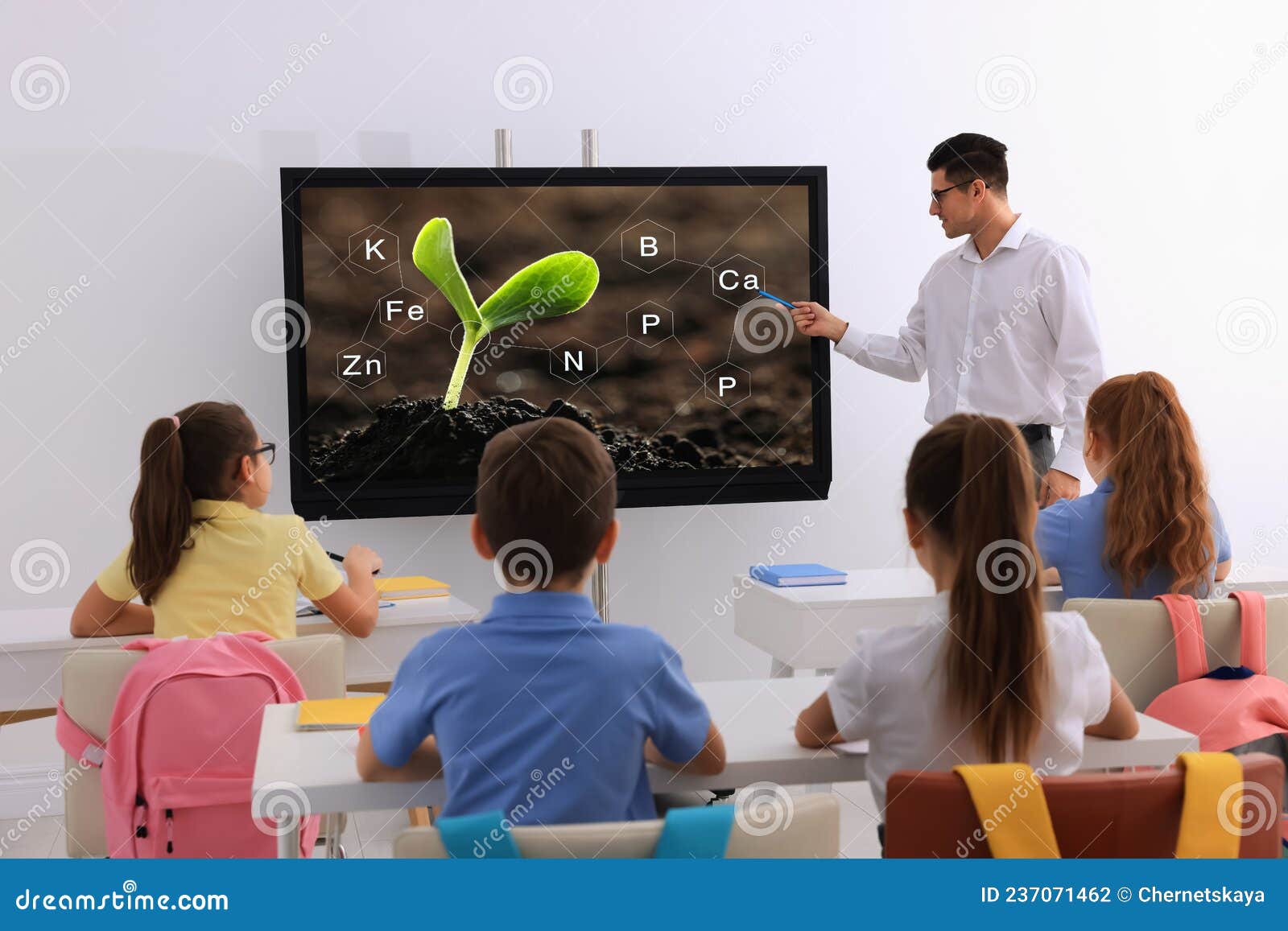 Teacher Using Interactive Board in Classroom during Lesson Stock Photo ...