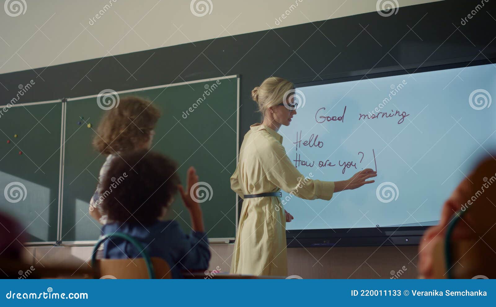 Teacher Using Interactive Digital Whiteboard. Student Writing on Smart ...