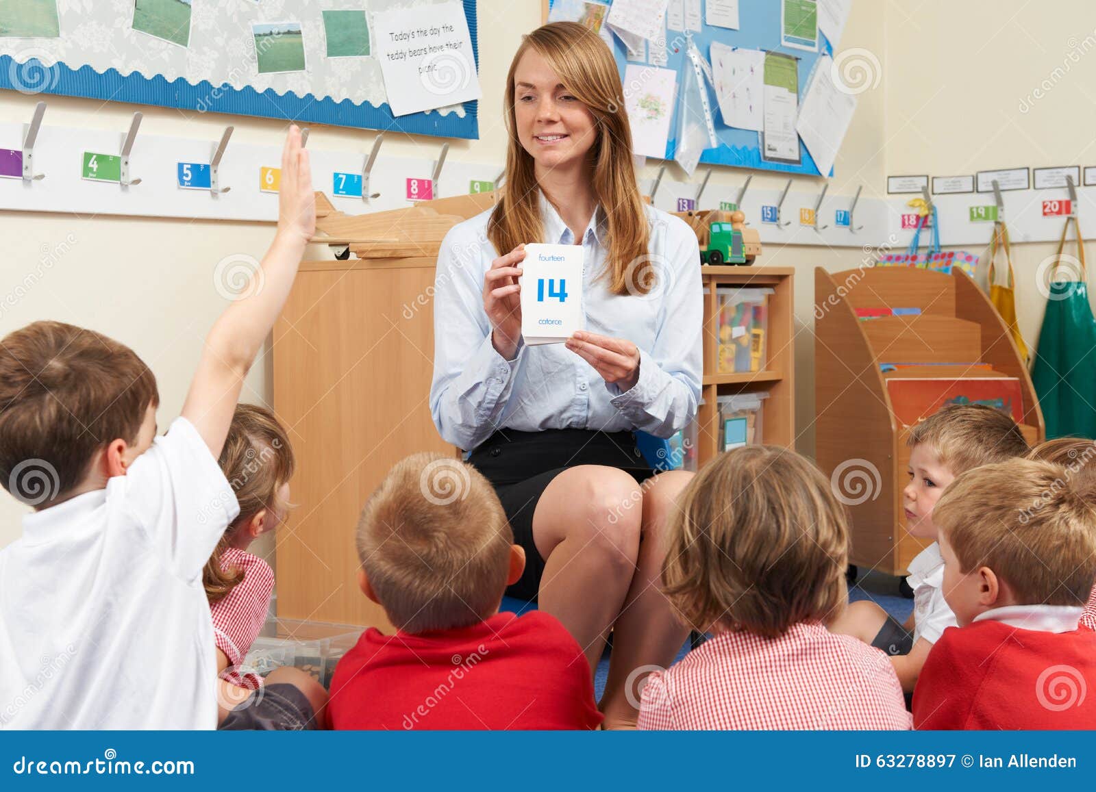 Teacher Using Number Flash Cards To Teach Maths Stock Image - Image of ...