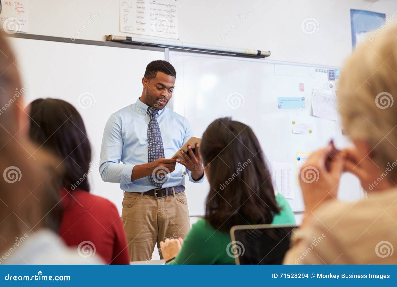 Teacher Using Tablet Computer at an Adult Education Class Stock Photo ...