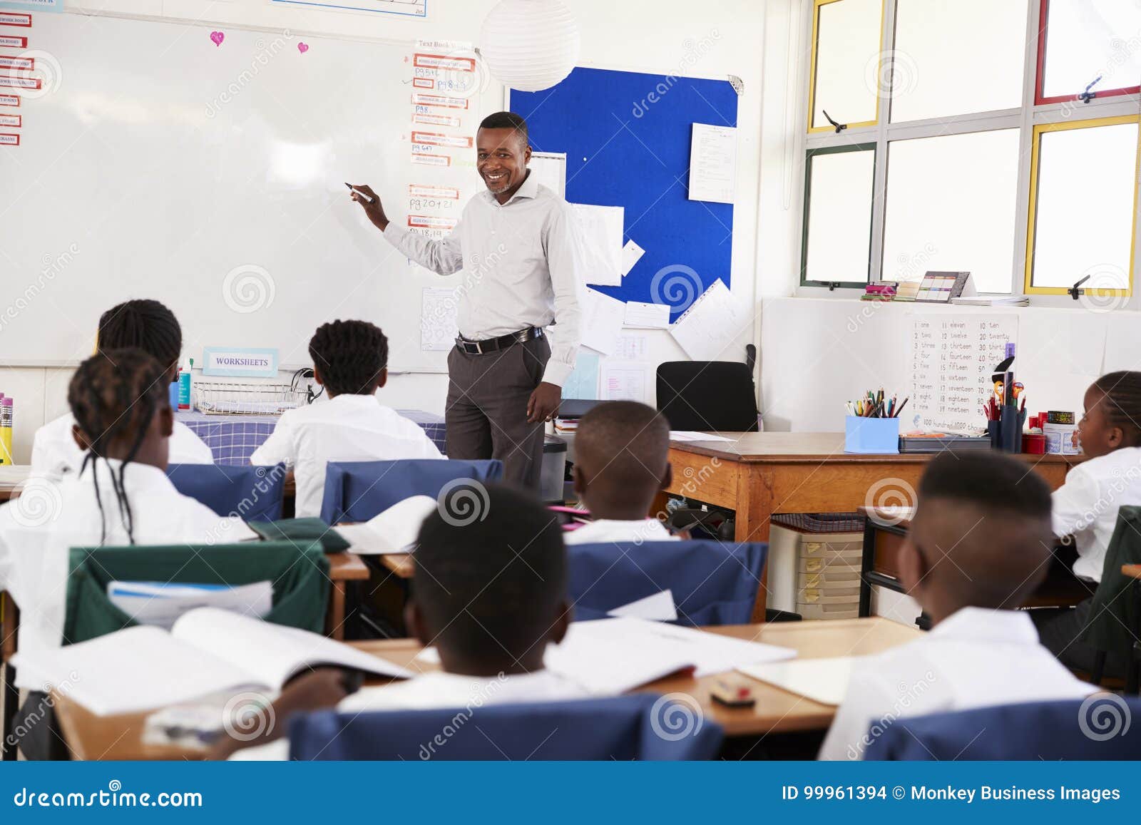 Teacher Using Whiteboard during a Lesson at an Elementary School Stock ...