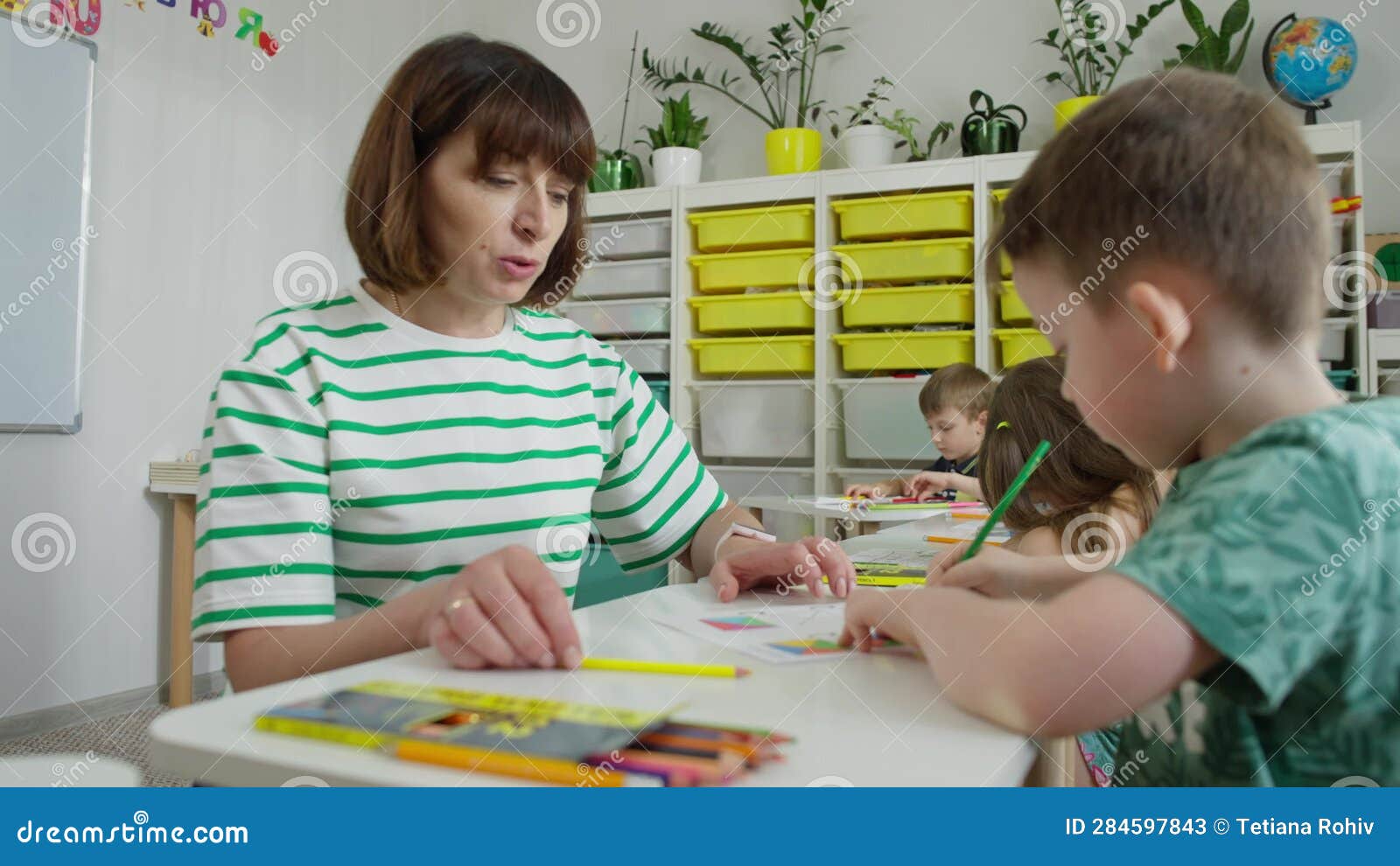 The Teacher is Watching the Boy Who is Doing the Task. Stock Video ...