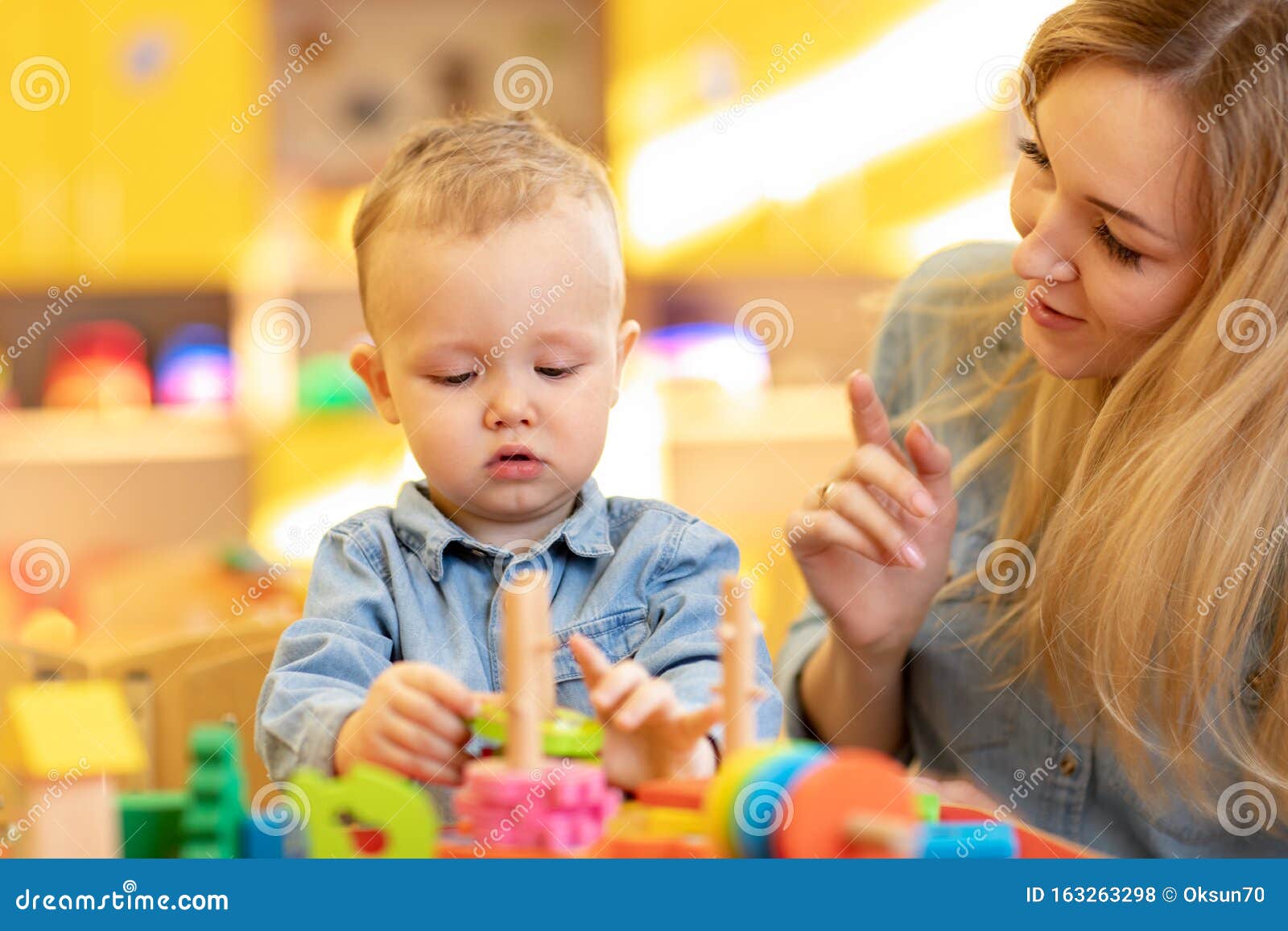 Teacher Watching Kid Playing with Toy Stock Photo - Image of happiness ...