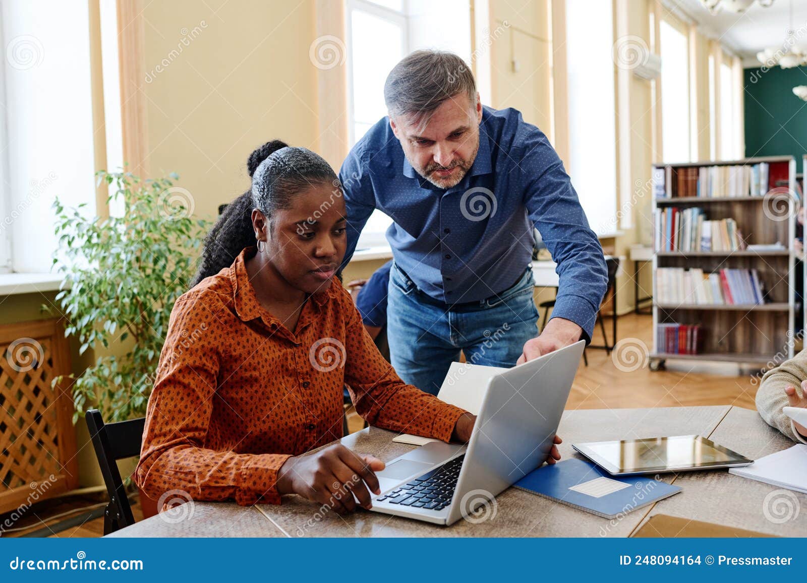 Teacher Watching Student Doing Task Stock Photo - Image of migrant ...