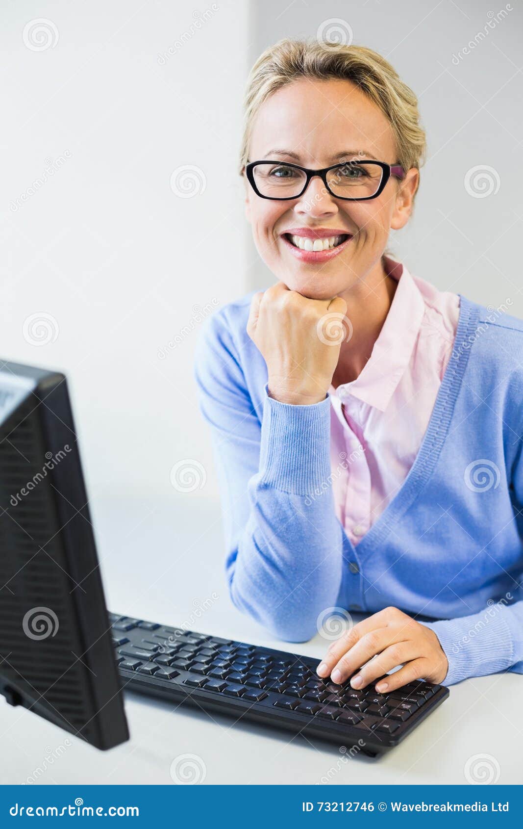 Teacher Working on Computer in Classroom Stock Photo - Image of adult ...