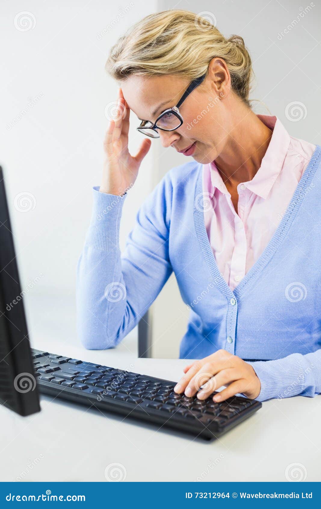 Teacher Working on Computer in Classroom Stock Photo - Image of mature ...