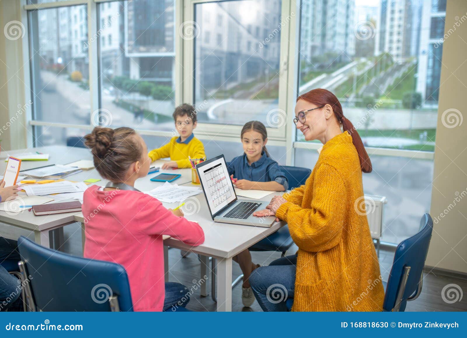 Teacher Working with a Small Group of Kids Stock Photo - Image of nice ...