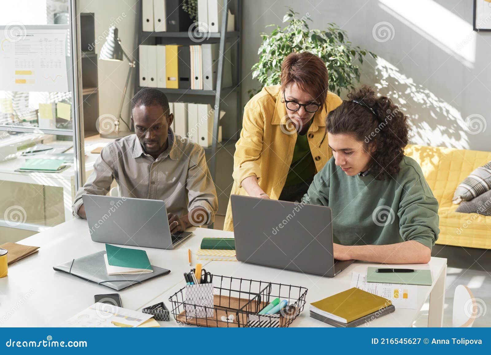Teacher Working with Students at Office Stock Image - Image of women ...