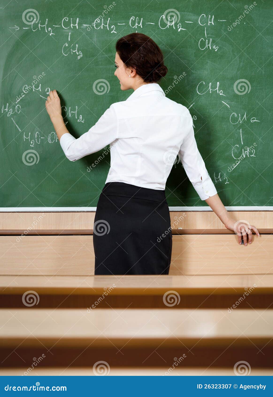 Teacher Writes At The Blackboard Royalty Free Stock Photography - Image ... Teacher Writes At The Blackboard Royalty Free Stock Photography - Image ...