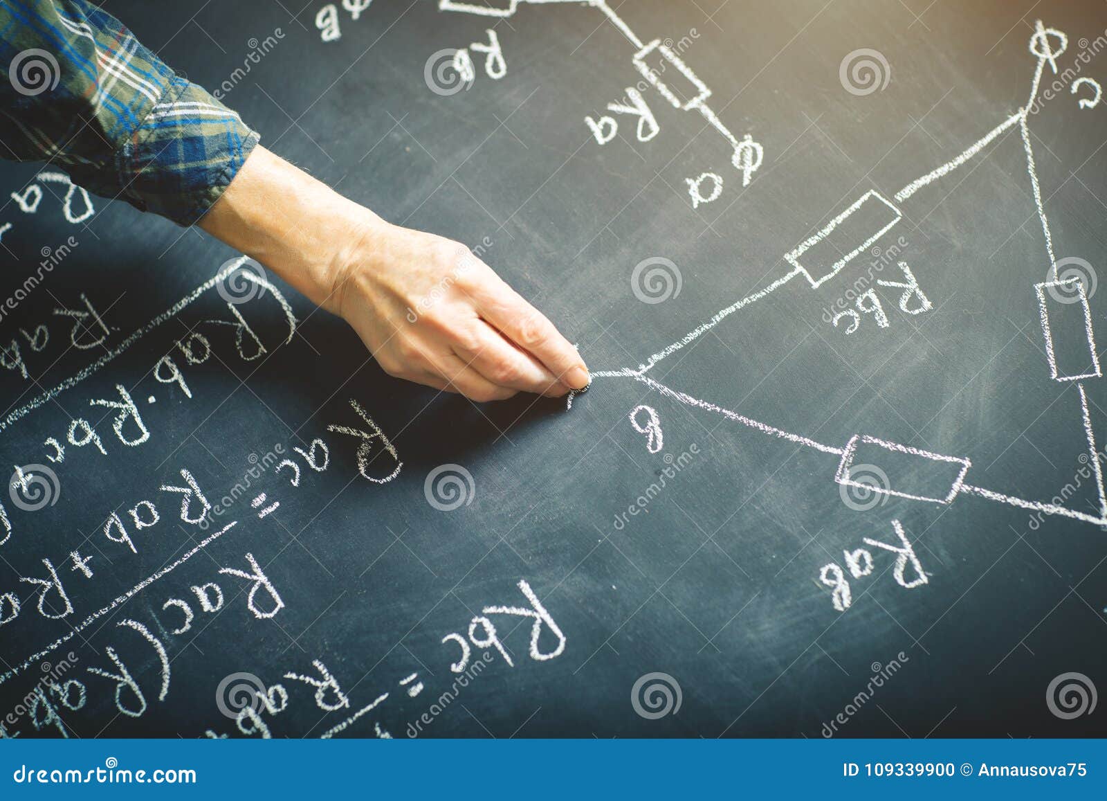 The Teacher Writes on a Board with Chalk a Formula for Electric Current ...