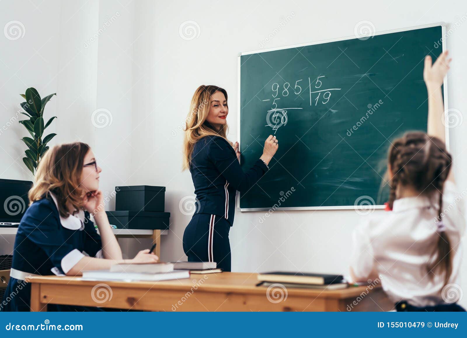 Teacher Writes a Mathematical Example on the Blackboard Stock Image ...
