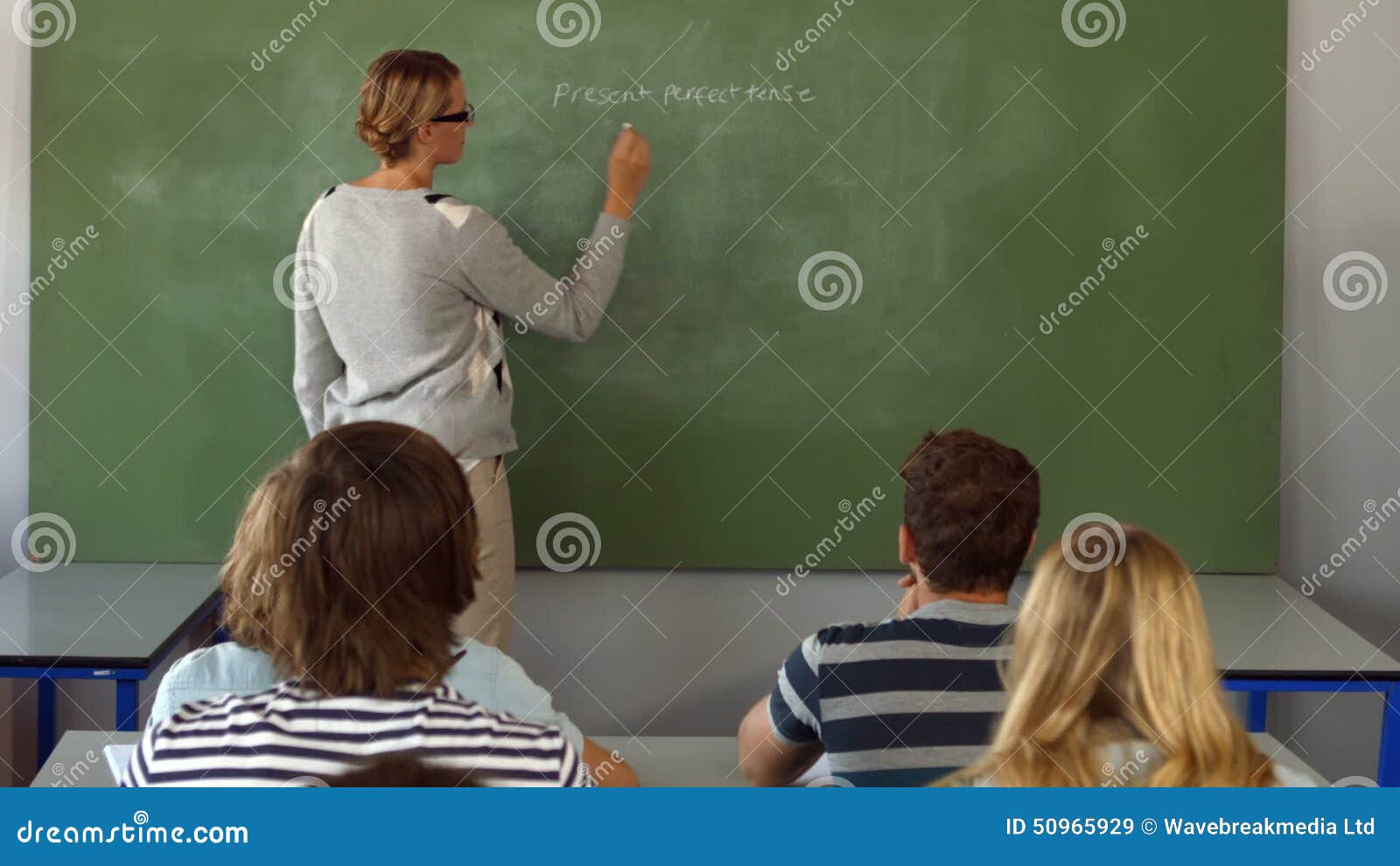 Teacher Writing on Blackboard in Class Stock Video - Video of college ...