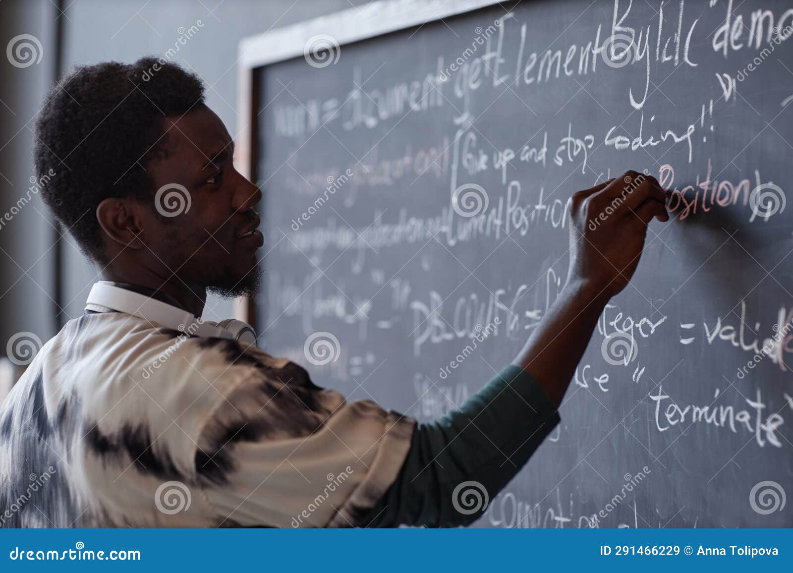 Teacher Writing on Blackboard in the Classroom Stock Image - Image of ...